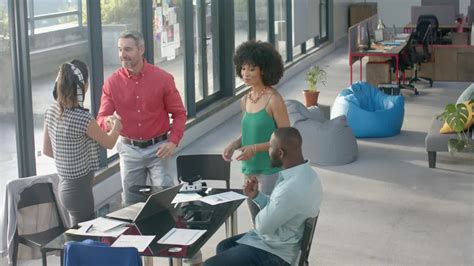 Team Of Diverse Colleagues Shaking Hands With Each Other At Office