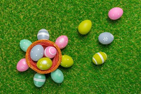 Premium Photo Easter Eggs On The Grass