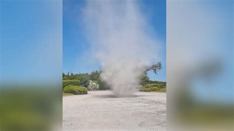 Woman Left Shocked As Dust Devil Sweeps Through Bluestone Resort Car Park In Pembrokeshire Itv