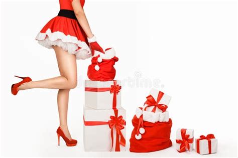 Christmas Card With Young Woman With Long Legs On Red Heels And Santa