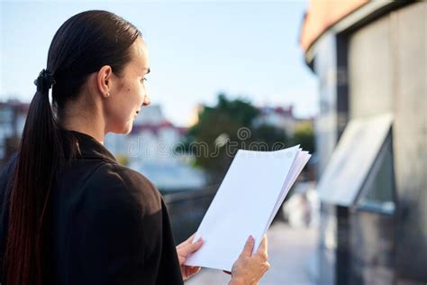 Young Brunette Business Woman Wearing Stylish Black Jacket Looking At