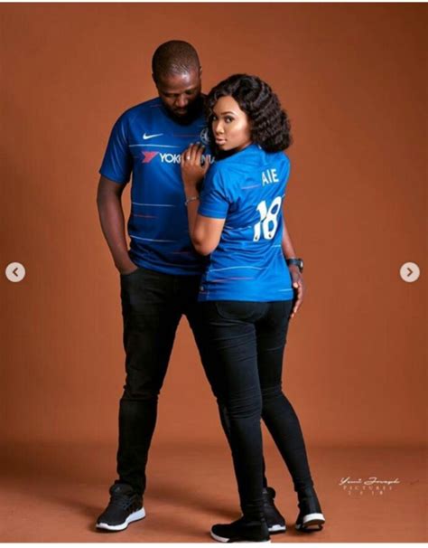 Man Lifts His Fiancee In Matching Chelsea Pre Wedding Photos Outfits