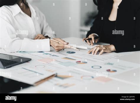 Group Of Business Woman And Accountant Checking Data Document For
