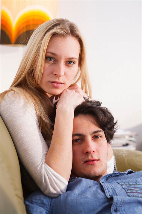 Young Couple Relaxing On The Sofa License Image 70995051 Lookphotos