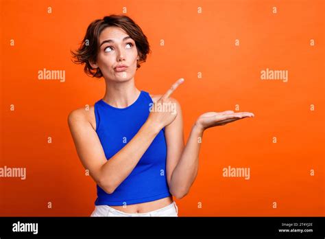 Photo Of Doubtful Unsure Lady Wear Blue Singlet Looking Showing Finger
