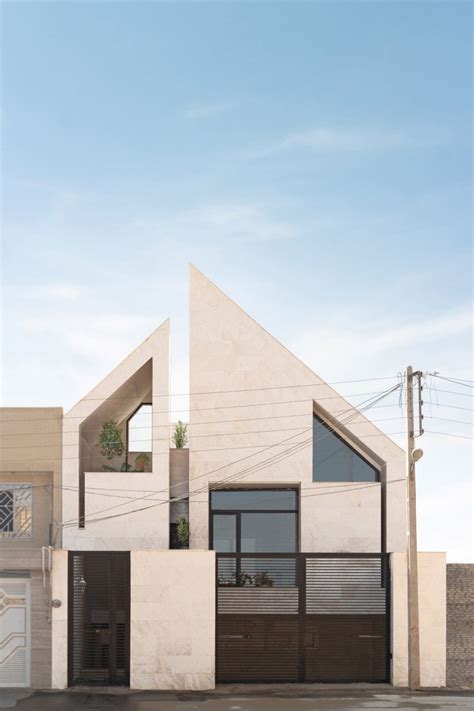 Awe Office Creates Apartments With Angular Stone Clad Facade In Iran
