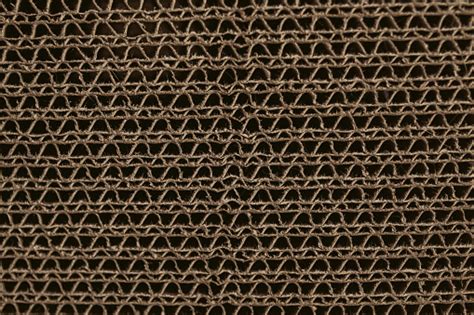 골 판지의 매크로 텍스처입니다 골 판지 골 판지 패턴입니다 추상 텍스처와 디자이너에 대 한 배경 갈색 종이 텍스처와 패턴 골 판지 배경의 근접 촬영 보기입니다 0명에 대한