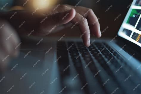 Premium Photo Hacker Hand And Typing On Laptop At Night As Thief For Malware Hacking Database