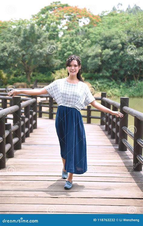 Beautiful Asian Girl Dressed In Traditional Elements Dress Showing