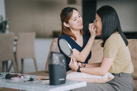 Asian Chinese Female Makeup Artist With Disability Deformed Arm Drawing