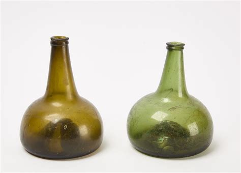 Two Early Blown Glass Squat Bottles Sold At Auction On 21st September