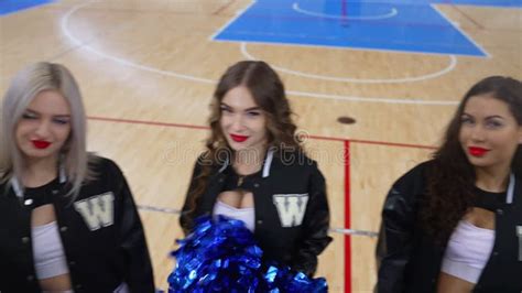 Caucasian Cheerleaders In The Black And White Uniforms Looking At The Camera Stock Footage