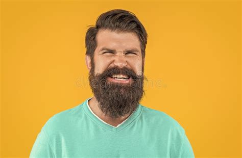 Portrait Of Angry Bearded Man On Background Portrait Of Bearded Man