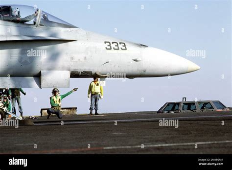 A Catapult Crew Member Signals As A Strike Fighter Squadron 106 Vfa
