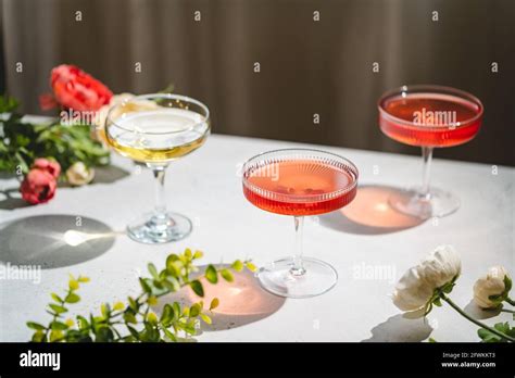 Sparkling Wine Or Champagne Glasses On White Background With Sharp