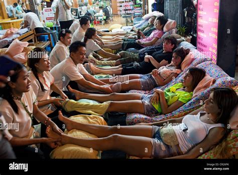 Foreign Tourists Receive Massage In Public On Khao San Road Bangkok