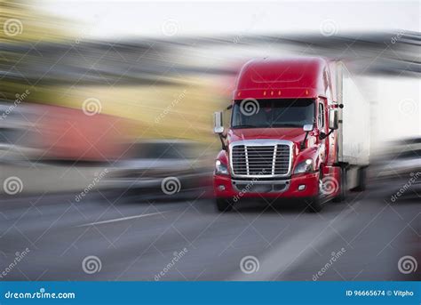 Bright Red Modern Big Rig Semi Truck With Semi Trailer Move With Stock