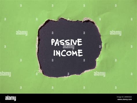 Passive Income Words Written On Green Torn Paper With Black Background Conceptual Symbol Copy