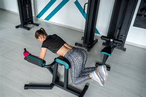 Sporty Girl Shows Her Well Trained Body In The Gym Where There Are Many