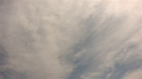 Wispy Clouds With White Puffy Clouds Framing Stock Footage Sbv