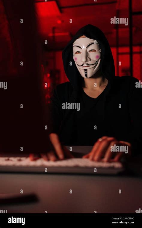 Close Up Vertical Shot Of Wanted Hacker Man Wearing Anonymous Mask And