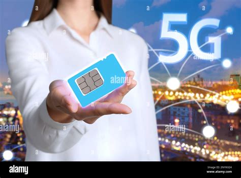 Woman Demonstrating 5G SIM Card Model And Cityscape With Connection Lines On Background Closeup