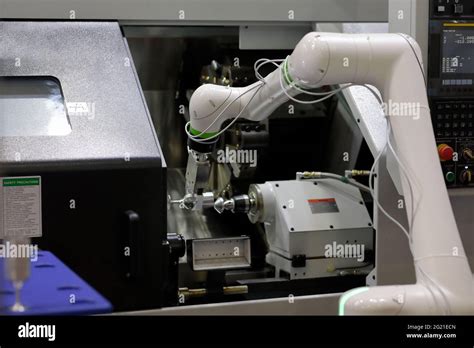 CNC Lathe Machine And Collaborative Robot Loading The Workpiece Stock Photo Alamy