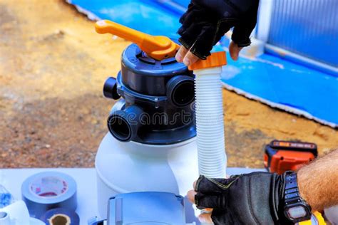 Maintenance Worker Assemble A Sand Filter System Tank Equipment For