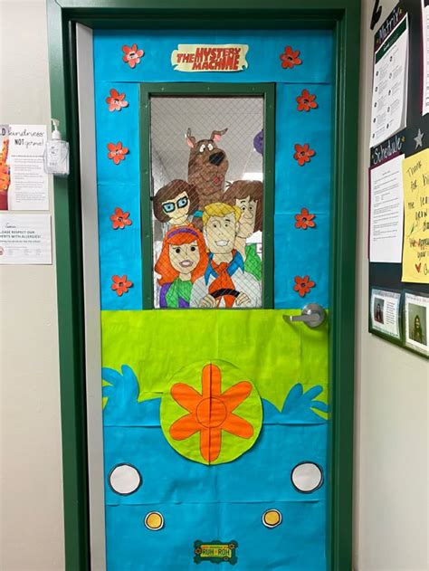 A Door Decorated To Look Like A School Bus With Cartoon Characters On