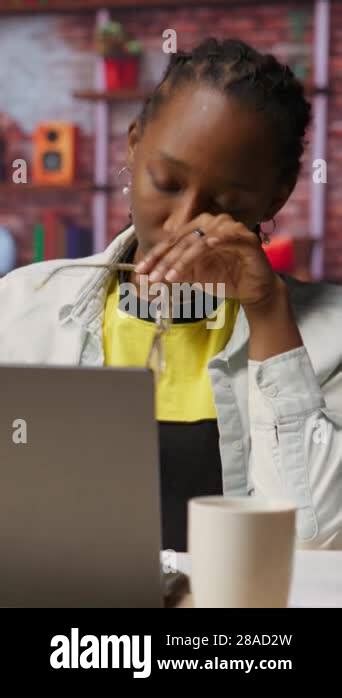 Vertical Video Overworked Freelancer In Apartment Trying To Relax Closing Eyes After Working
