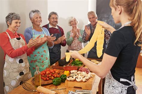Enjoy Cooking Time A Group Of Seniors Attending A Cooking Class Stock
