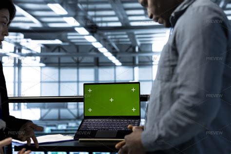 Engineers In Data Center Using Automation Tools On Green Screen Mockup