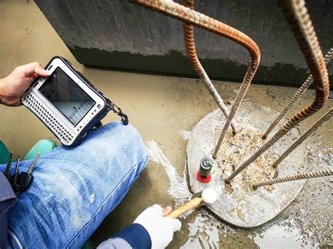 Engineering Seismic Test On A Concrete Pile In Construction Site Stock