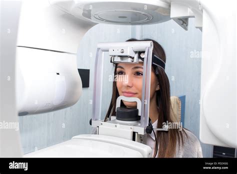 Close Up Head Shot Of Girl Taking Dental Tac With Cephalometric