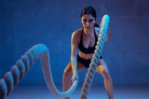 Premium Photo Girl Workout With Rope At Gym