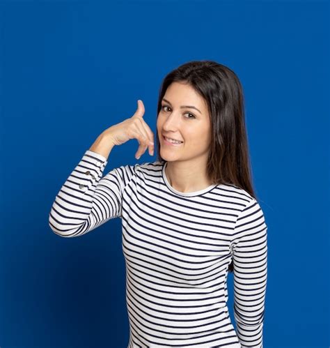 Premium Photo Brunette Young Woman Wearing A Striped T Shirt