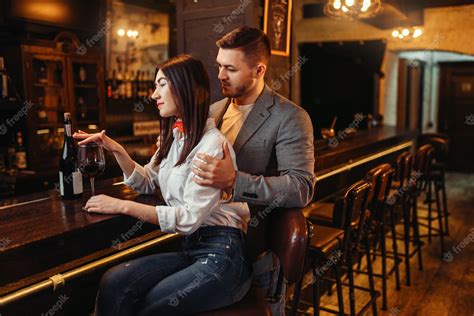 Premium Photo Man And Woman Relax Couple At Wooden Bar Counter