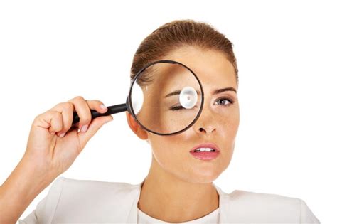 Premium Photo Portrait Of Businesswoman Holding Magnifying Glass