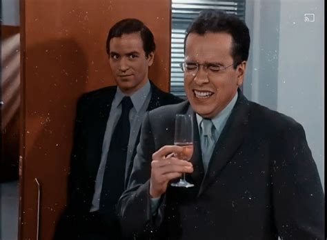 Two Men In Suits And Ties Holding A Wine Glass