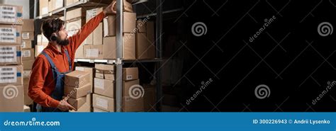 Caucasian Male Warehouse Operator Delivering Goods Dressed In Blue
