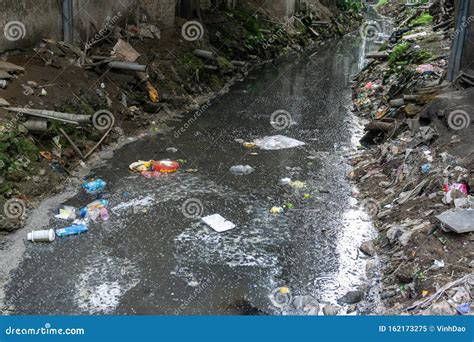 Dirty Polluted Waste Water In Big City With Garbages Environment