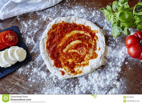 Baking Pizza Rolled Out Dough Blob Of Tomato Sauce Stock Image