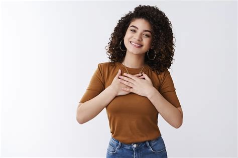 Premium Photo Young Woman Looking Flattered And Touched At Surprise