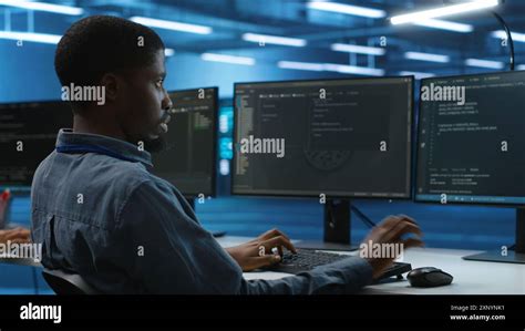 It Specialist In Server Farm Ensuring Valuable Data Remains Shielded From Potential Threats