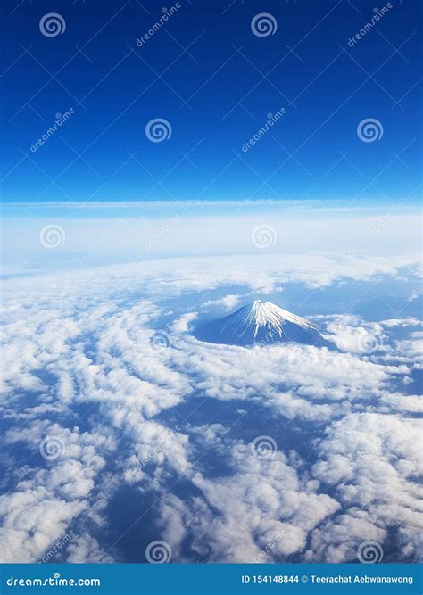 Top View Mt Fuji From Sky View On Window Seat Of Plane Blue Sky And