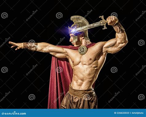 Young Muscular Man Posing In Roman Gladiator Costume Stock Image