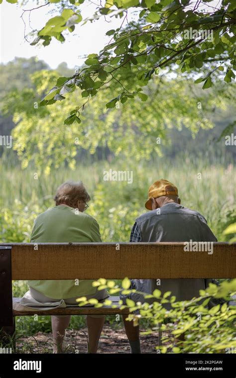 Elderly Couple Outdoors In Summer Happy Elderly Couple On A Walk
