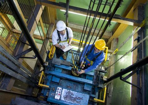 Engineers Working On Elevators