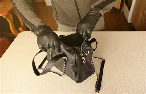 Robber In Black Outfit And Gloves See On Opened Stolen Women Bag A
