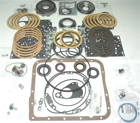 The Complete Engine And Gasket Set Is Displayed On A Table With Other Parts